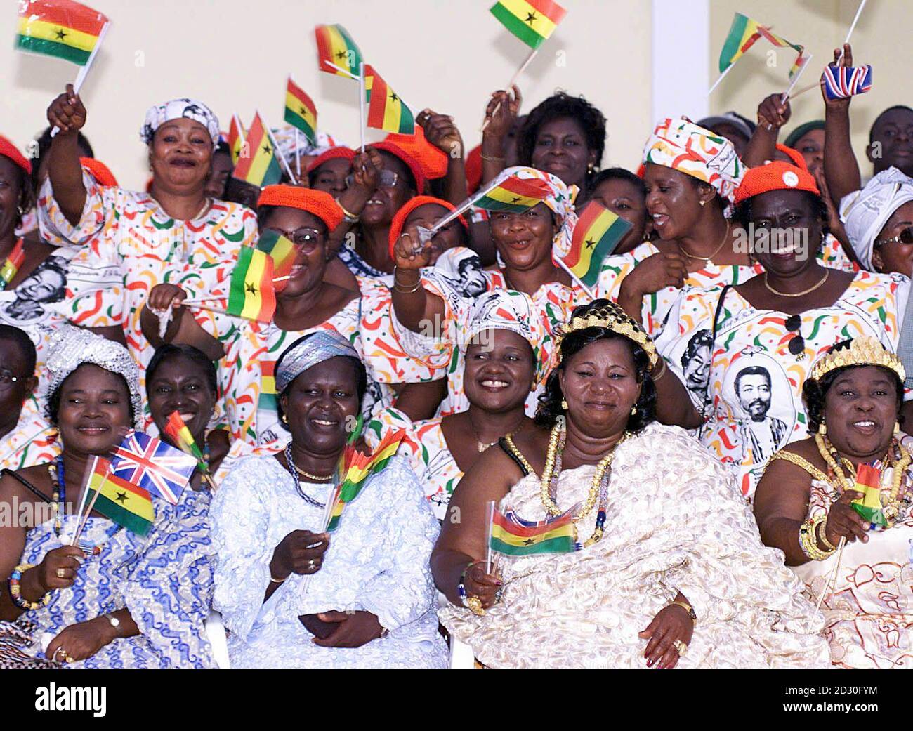 Traditionally dressed Ghanian women await the Queen's arrival at Kotoka ...