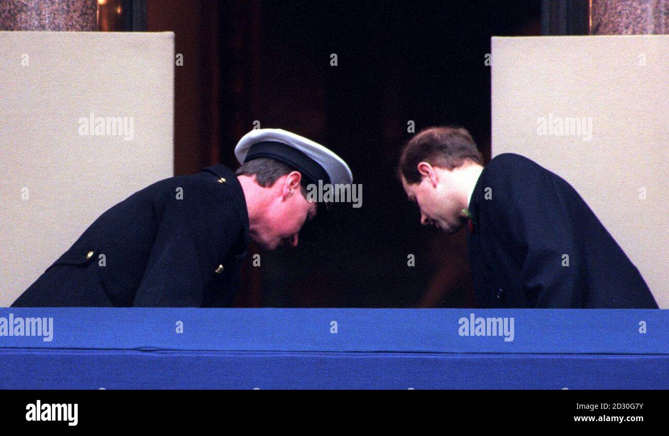 Commander Tim Laurence (left), and the Earl of Wessex, turn round as ...