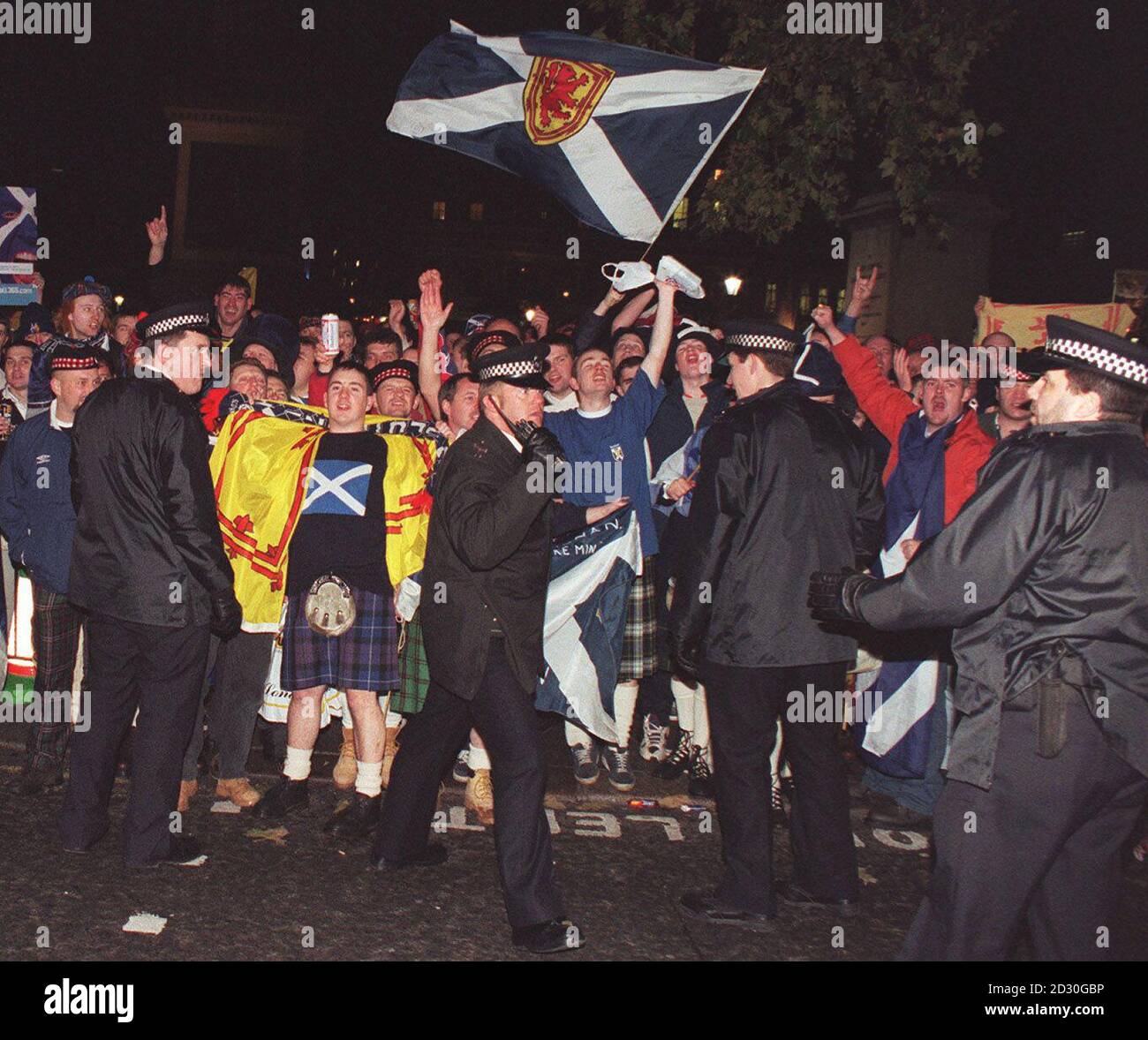 Scottish football fans are controlled by police in trafalgar square hi ...