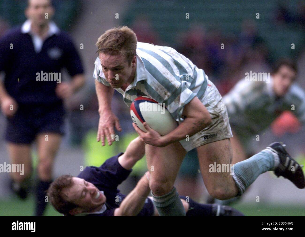 Robin Morrow (right) of Cambridge evades the clutches of John ...