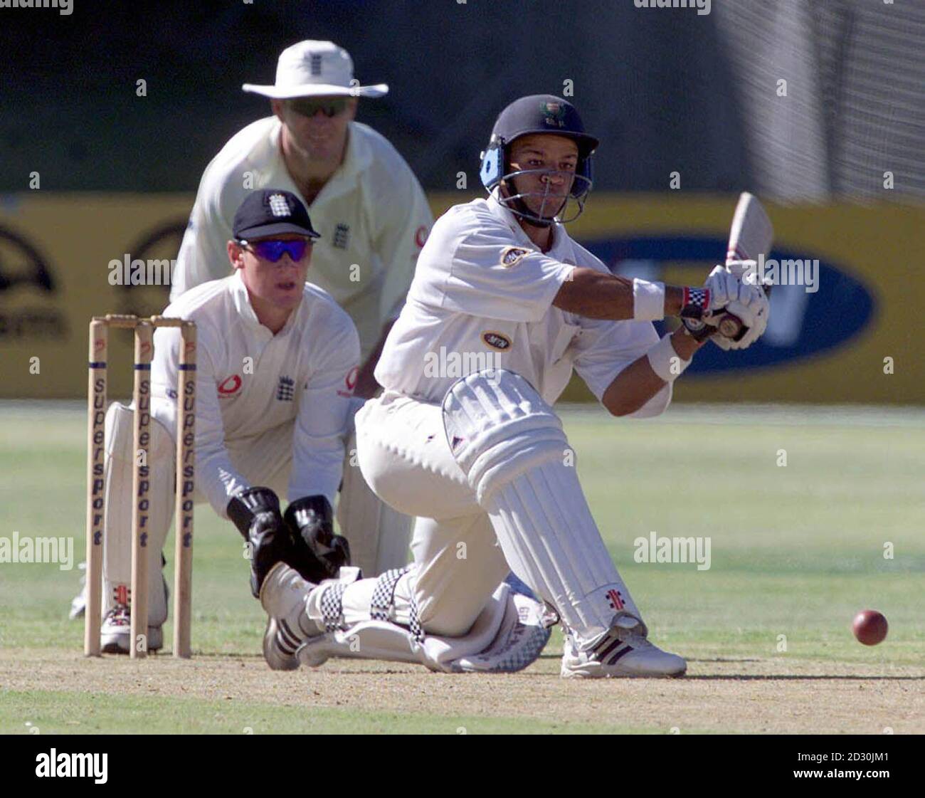 England wicket keeper Chris Read and captain Graeme Hick watch as ...