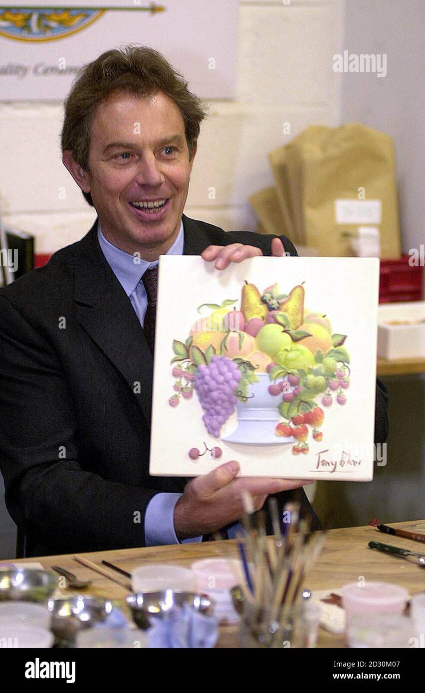 British Prime Minister Tony Blair shows off his handy work at the ...