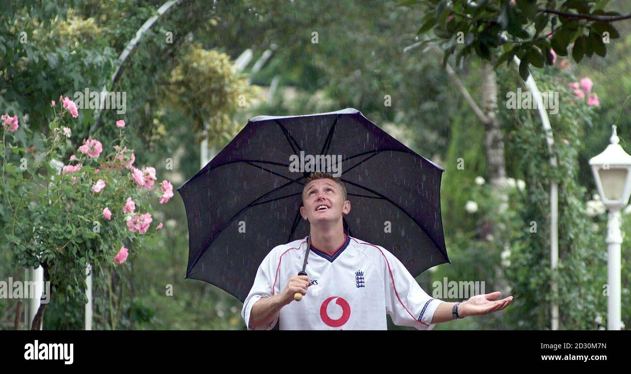 England cricketer Darren Maddy takes a walk in the rain around the ...