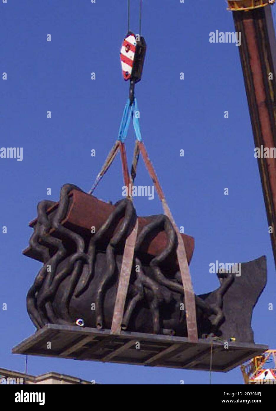 Cranes lower a new 11-ton sculpture onto the empty plinth in London's ...