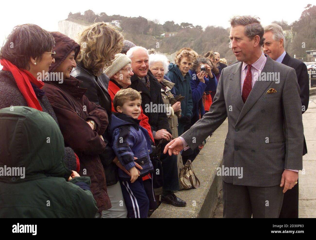 The Prince of Wales meeting local residents during a visit to the beach ...
