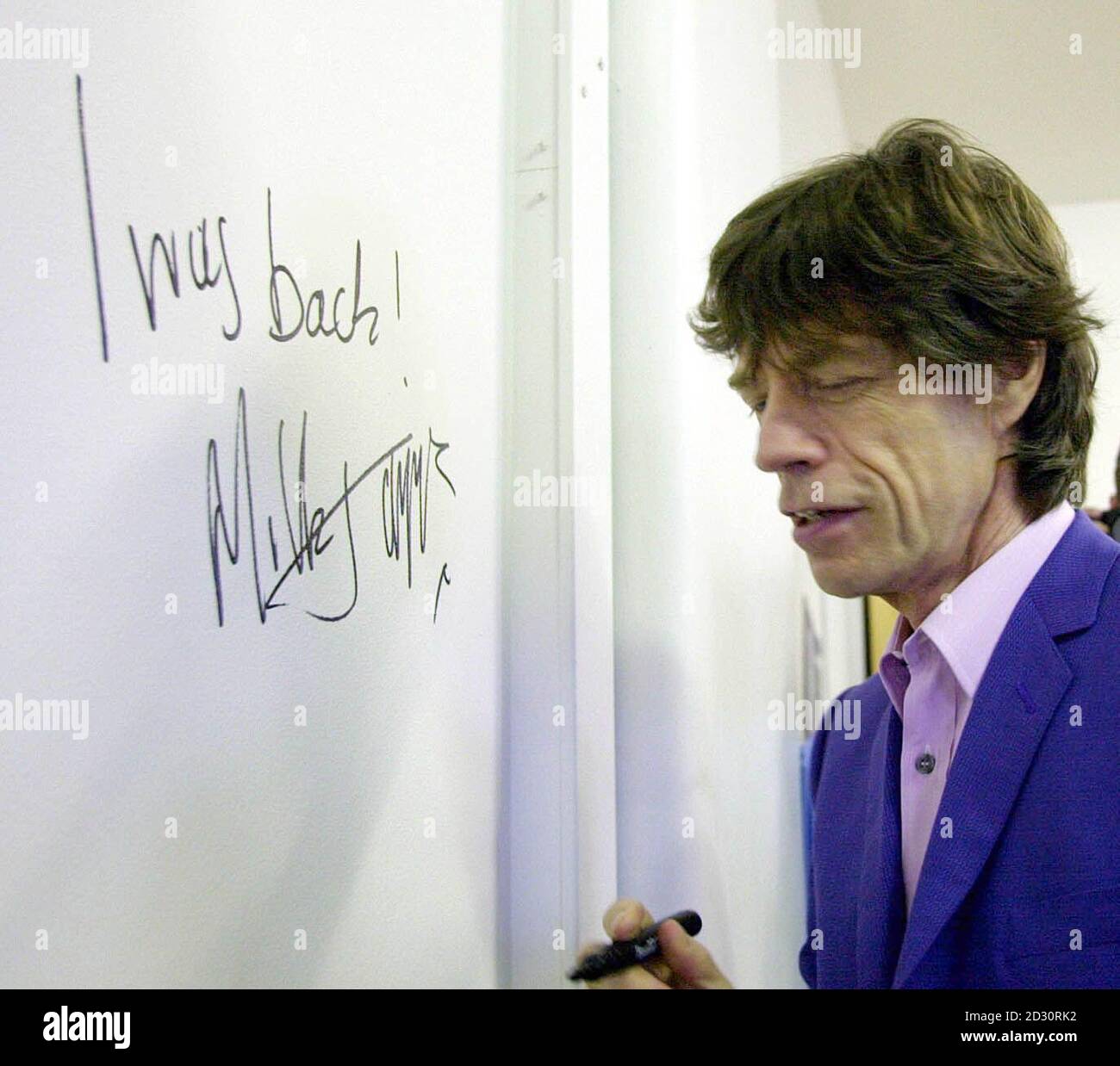 Mick Jagger's signs his autograph "I was back !", on the wall of the ...
