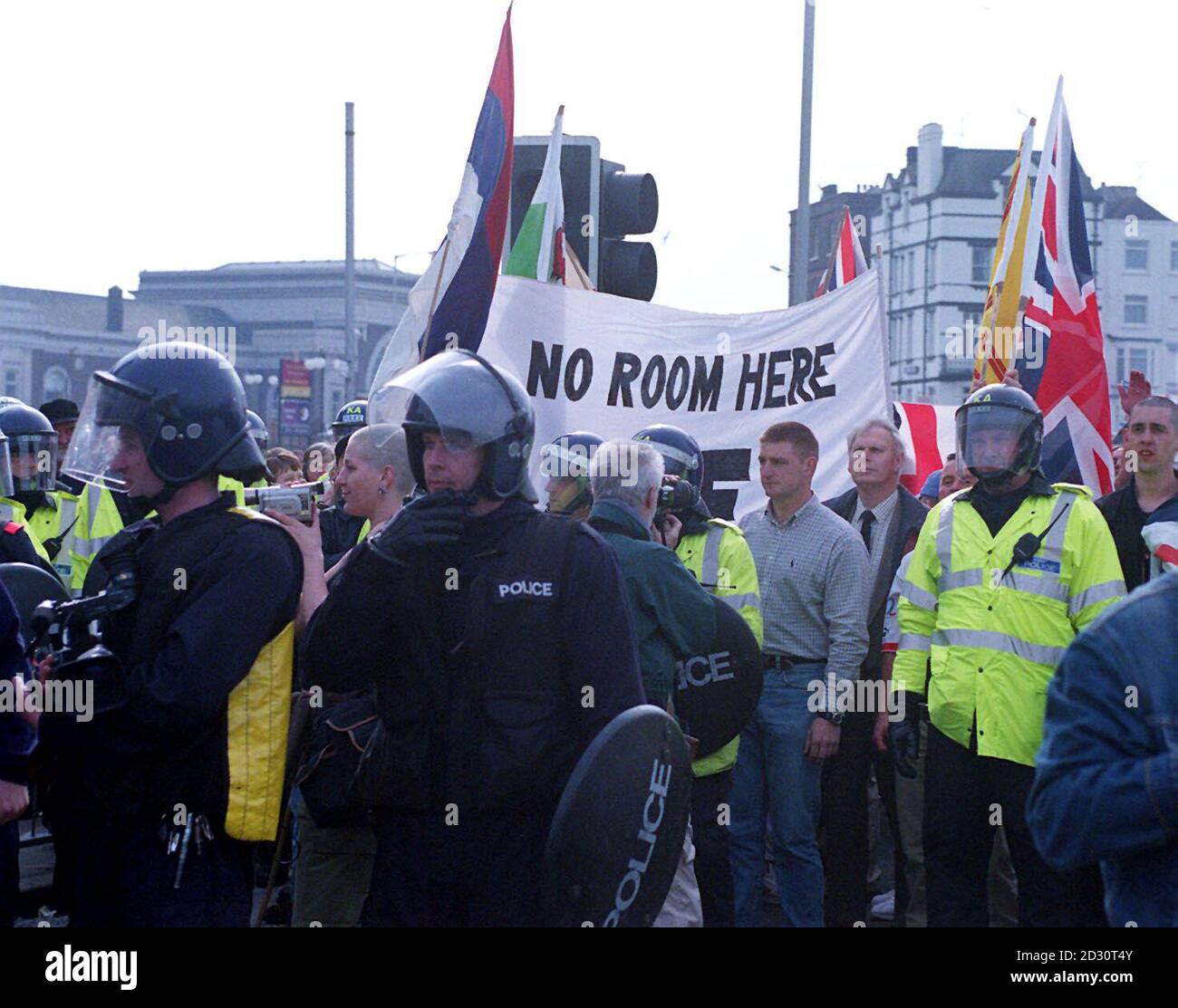 A heavy police presence throughout, with five people being arrested ...
