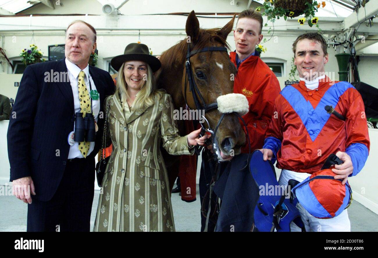 Jockey Richard Guest, winner of race six on ' Red Ark' with owner ...