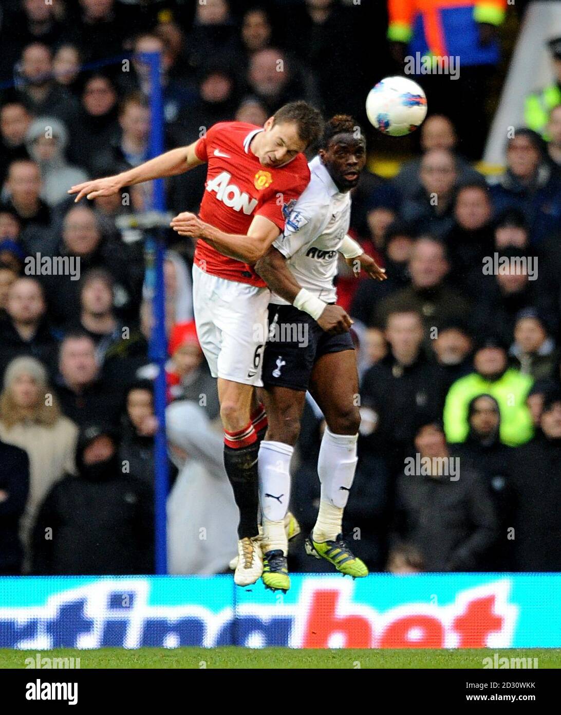 Manchester United's Jonathan Evans (left) and Tottenham Hotspur's Louis ...