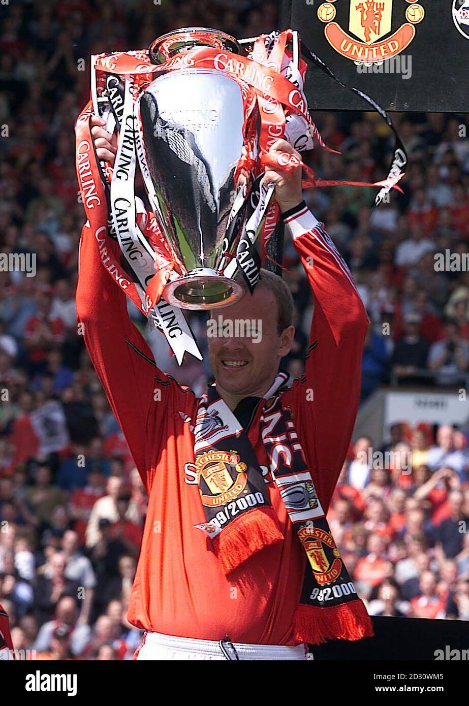 Manchester United's Henning Berg lifts the FA Carling Premiership ...