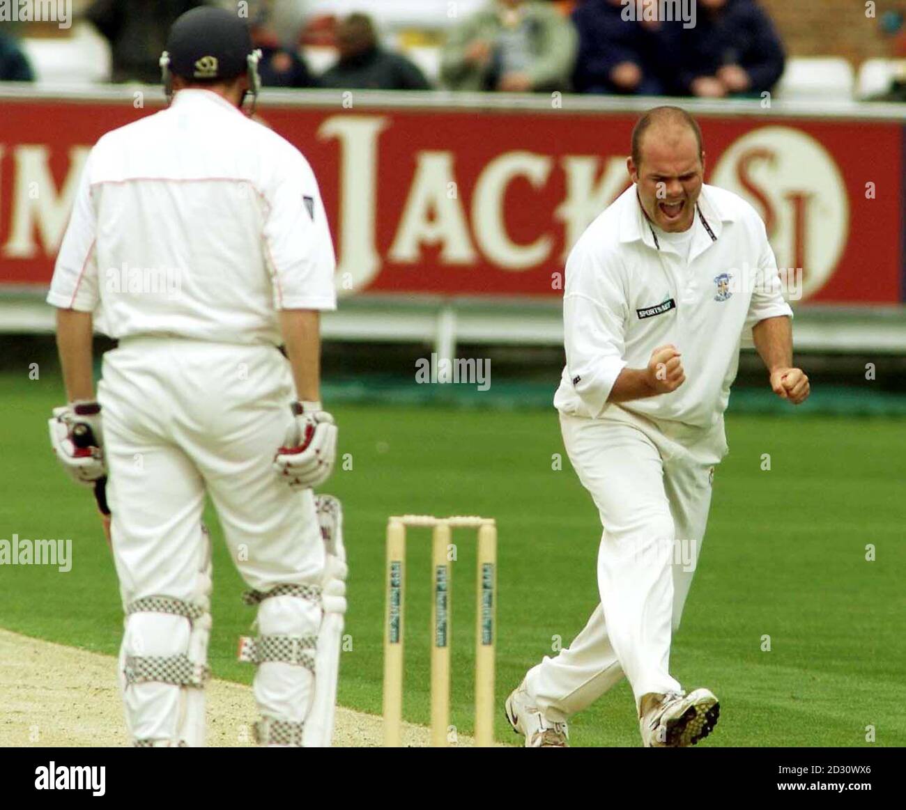 Durham's Neil Killeen (R) celebrates taking the wicket of Lancashire's ...