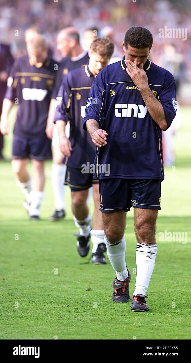 Wimbledon players leave the pitch lead by Walid Badir after they were ...