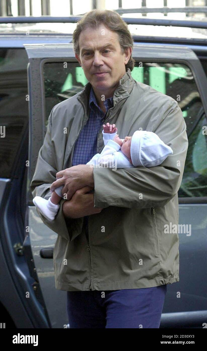 Britain's Prime Minister Tony Blair cradles his new born son Leo as ...