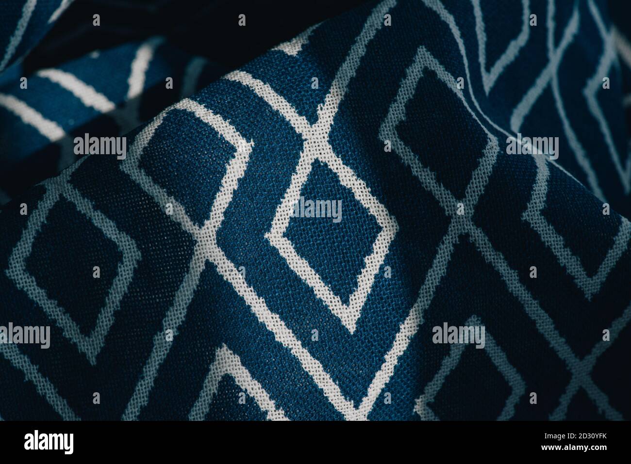 material textile background. Blue fabric in diamonds. Close-up of the ...