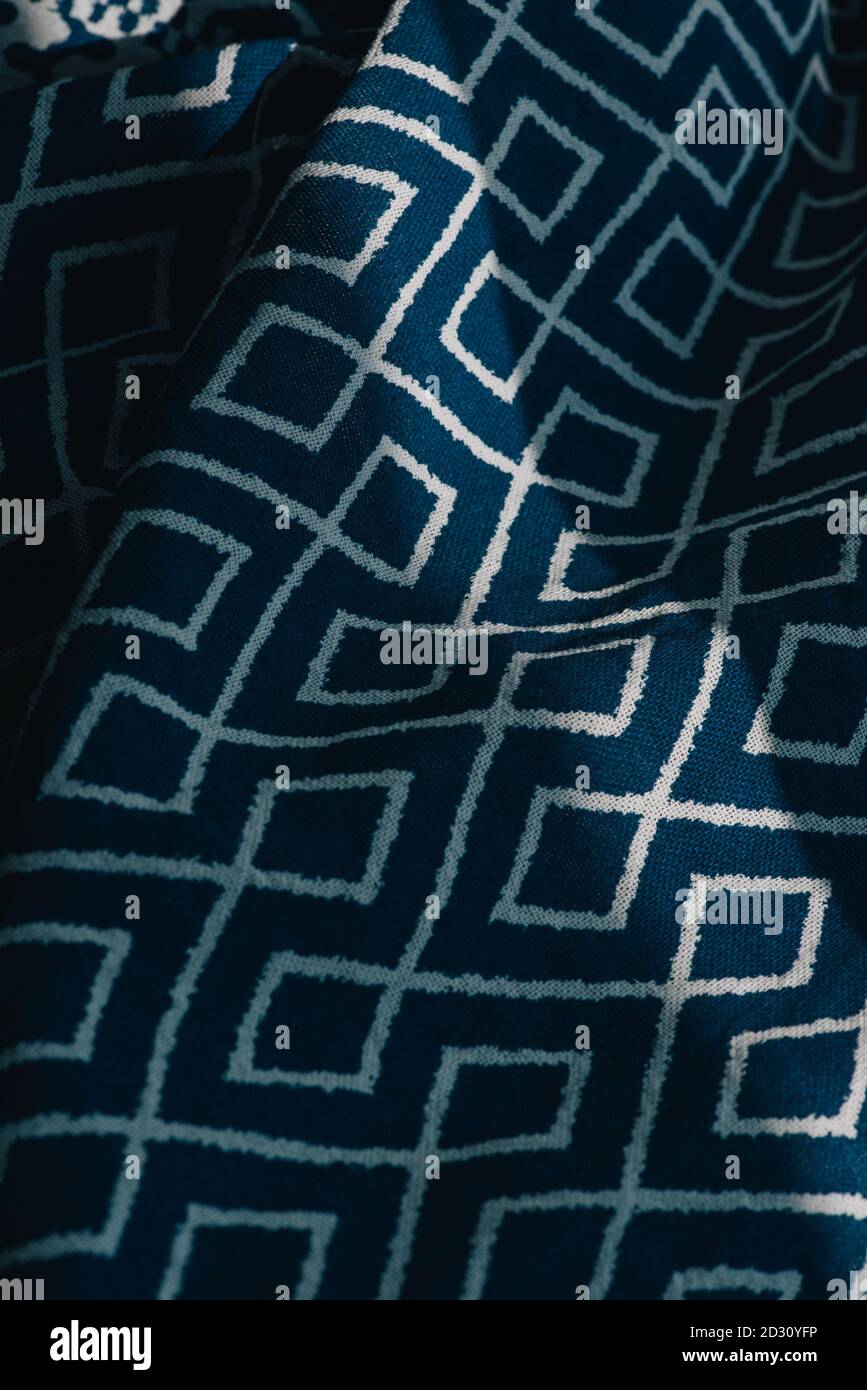 material textile background. Blue fabric in diamonds. Close-up of the ...