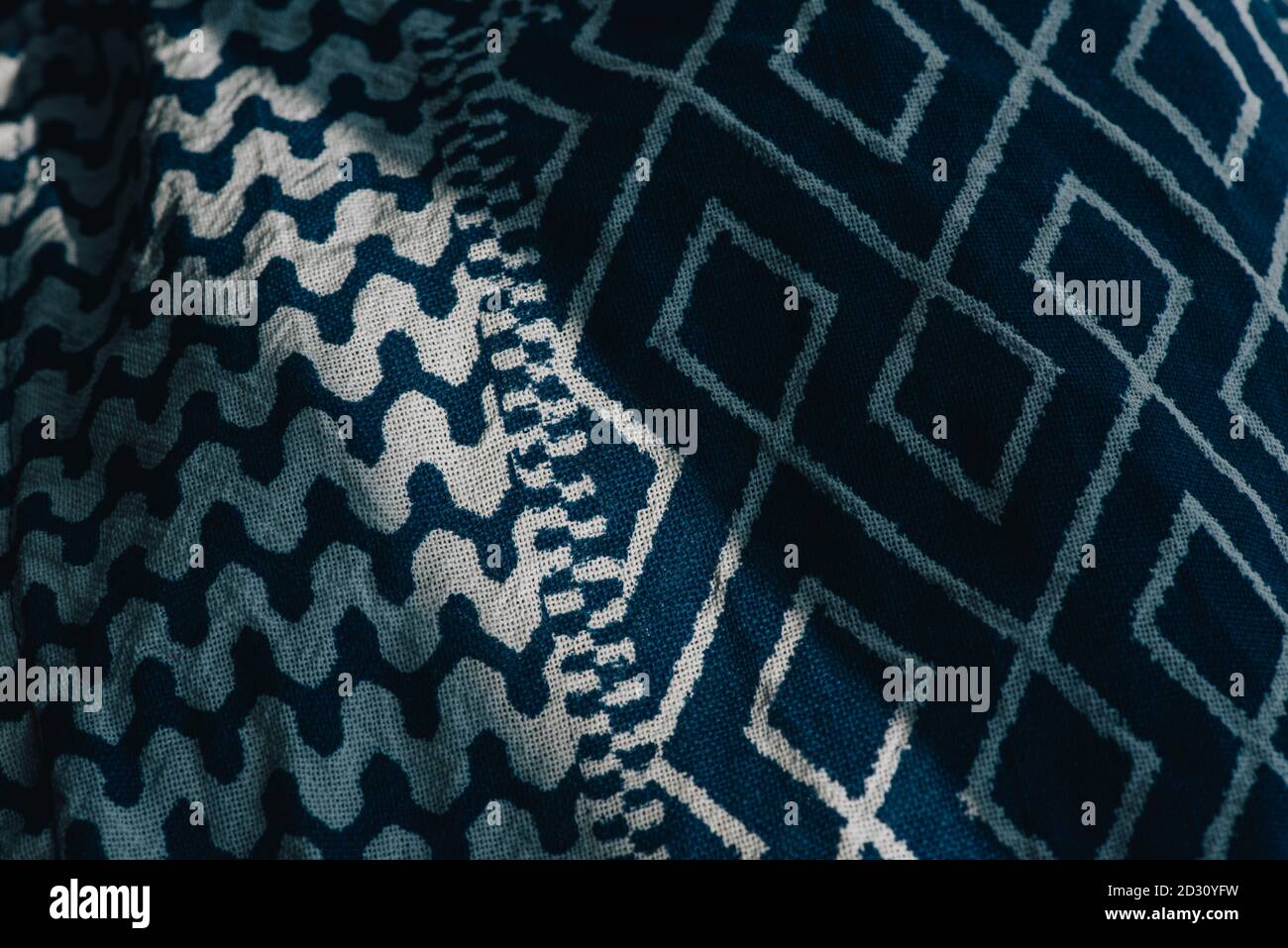 material textile background. Blue fabric in diamonds. Close-up of the ...