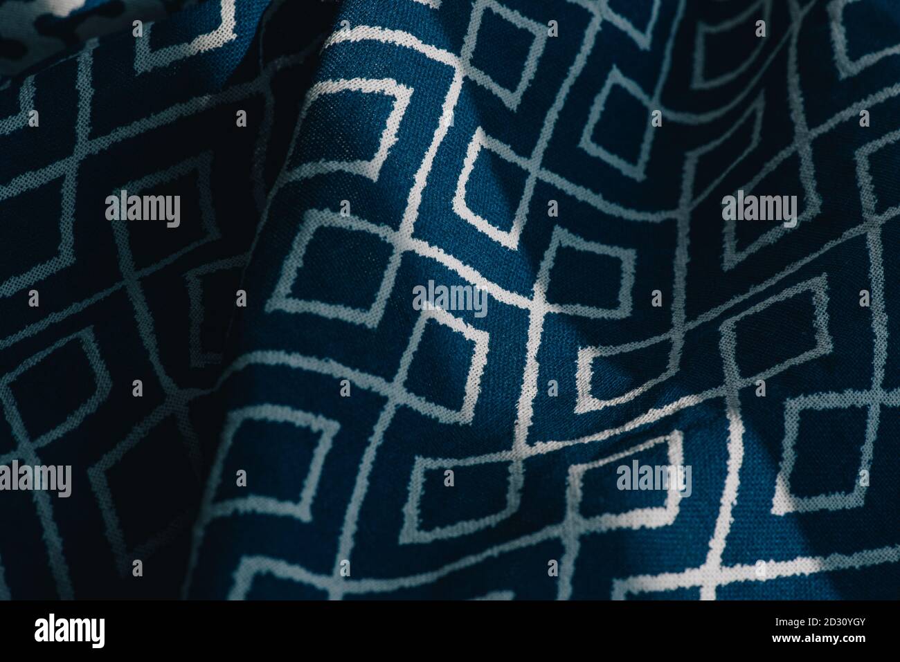 material textile background. Blue fabric in diamonds. Close-up of the ...