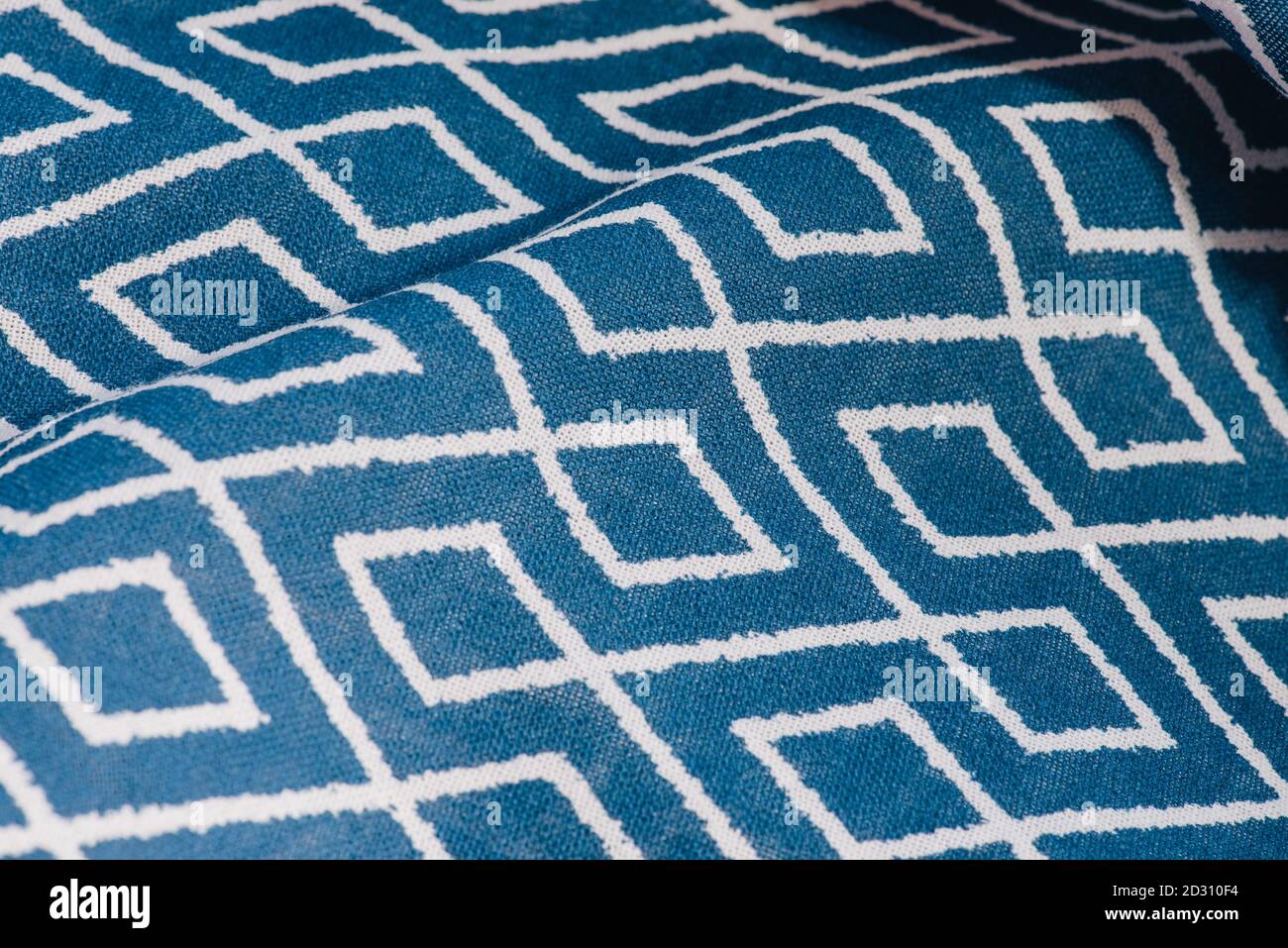 material textile background. Blue fabric in diamonds. Close-up of the ...