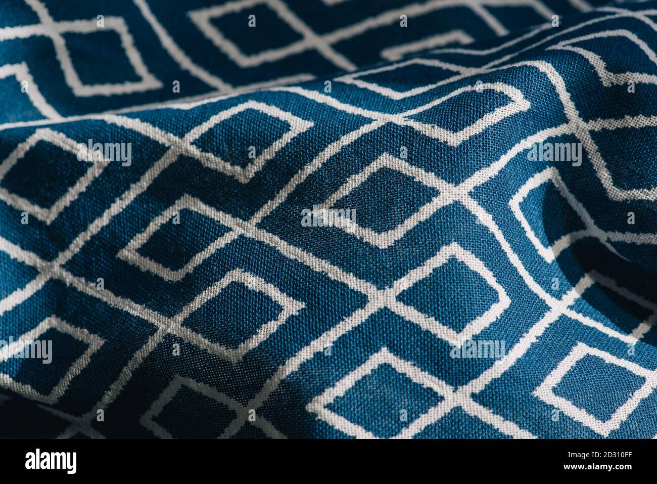 material textile background. Blue fabric in diamonds. Close-up of the ...