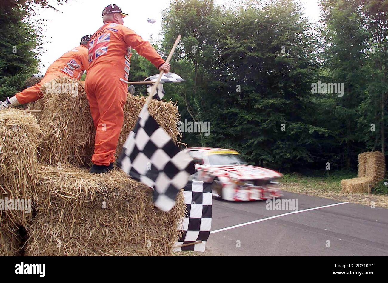 Sport motor racing chequered flag marshal car hi-res stock photography ...