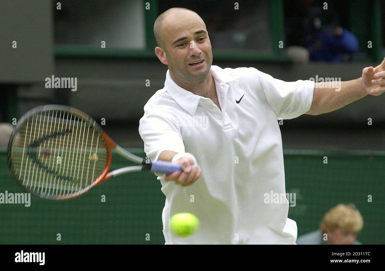 America's Andre Agassi in action against Mark Philippoussis of ...