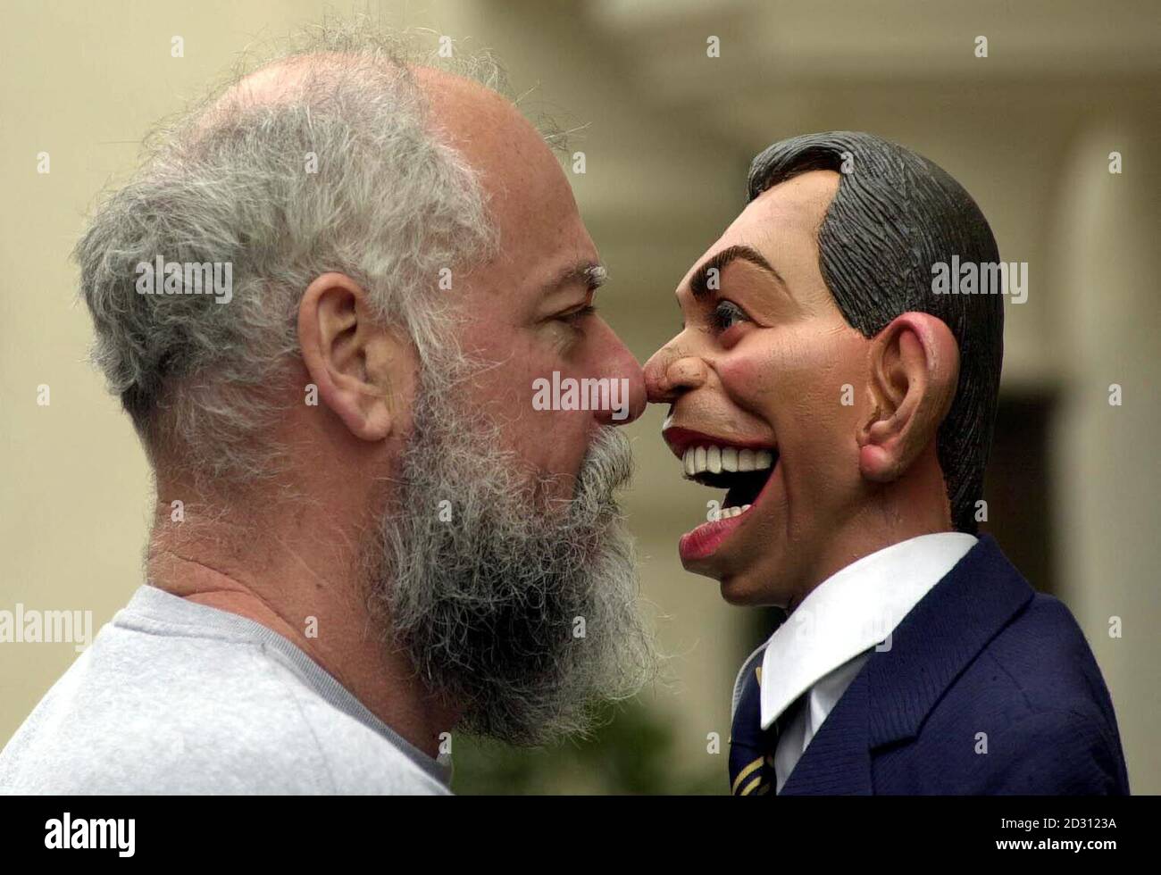 Spitting Image creator Roger Law holds a puppet of Tony Blair by the ...