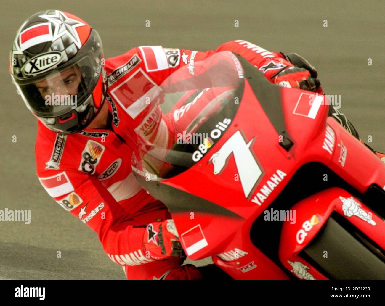 Spain's Carlos Checa riding an Yamaha keeps his eyes on the track ...