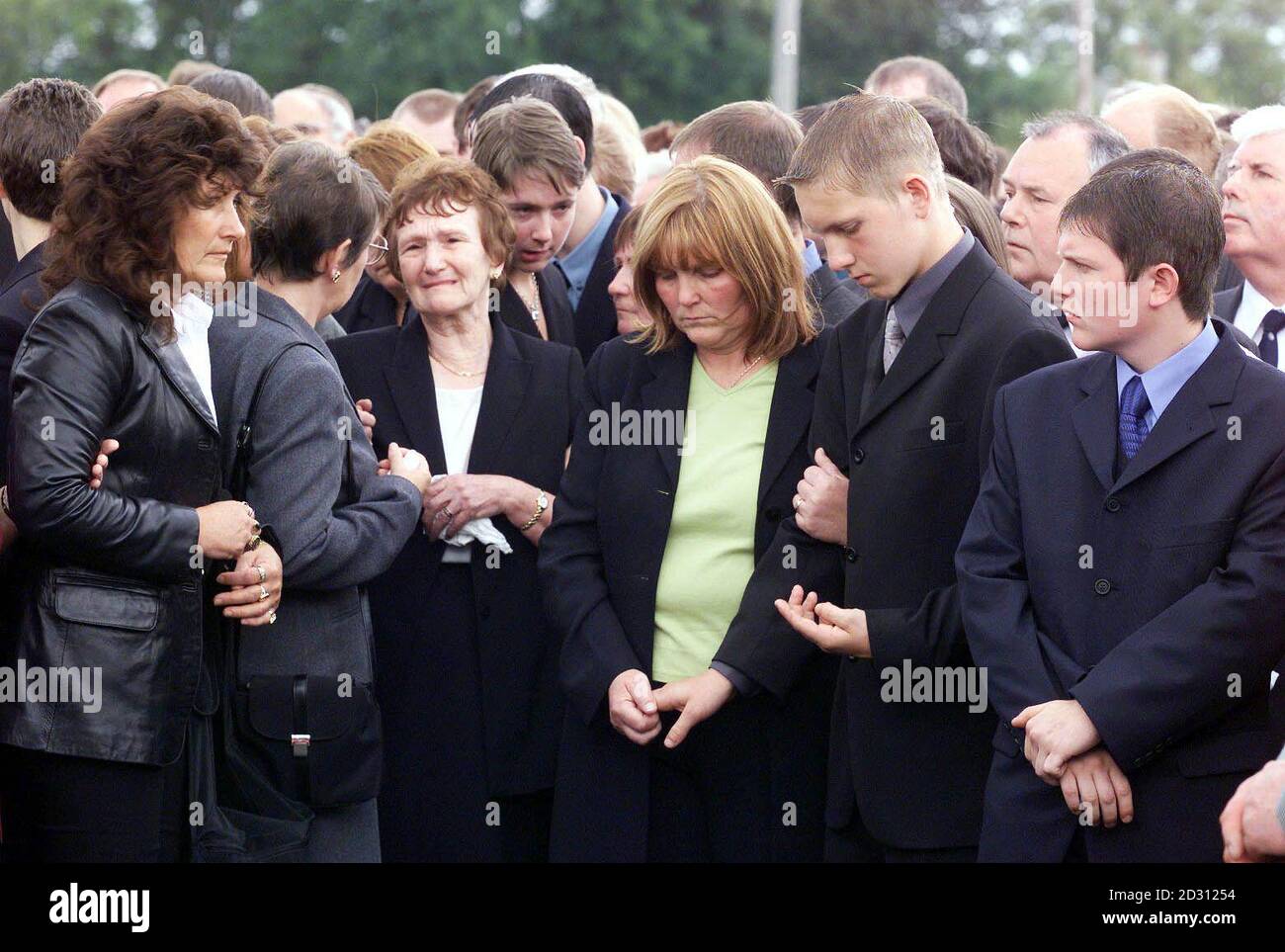 Joey Dunlop's wife Linda (third from right) with sons Gary and Richard ...