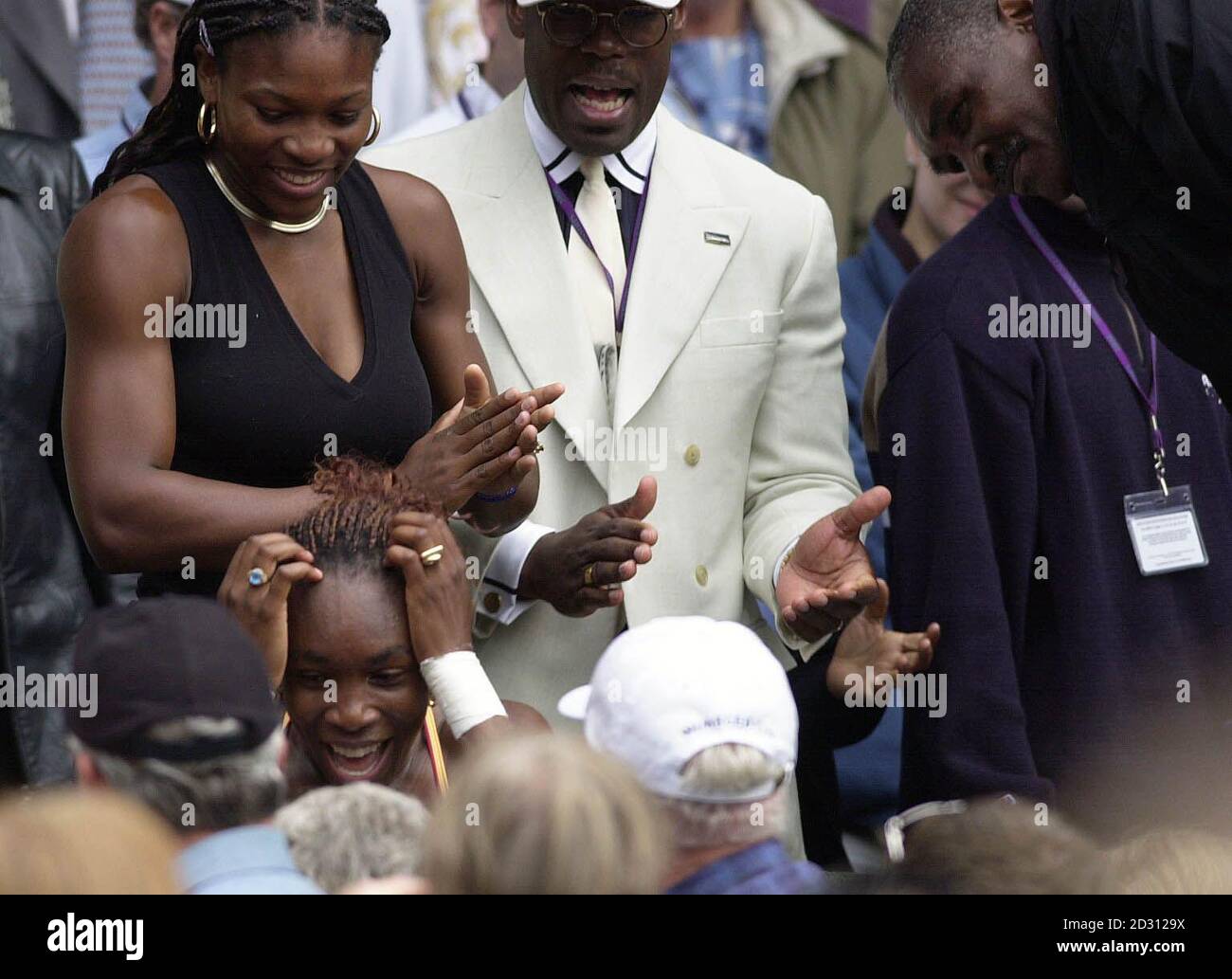 NO COMMERCIAL USE: America's Venus Williams (bottom, left) celebrates ...