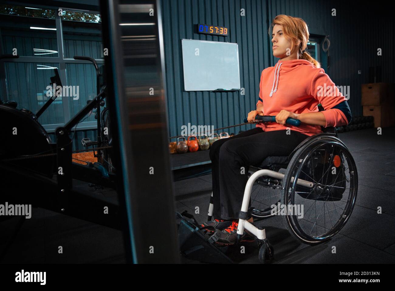 Weights. Disabled woman training in the gym of rehabilitation center ...
