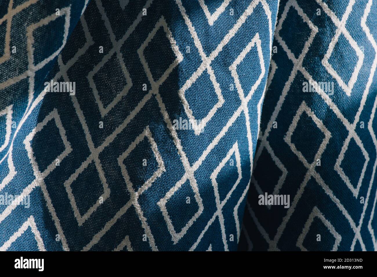 material textile background. Blue fabric in diamonds. Close-up of the ...