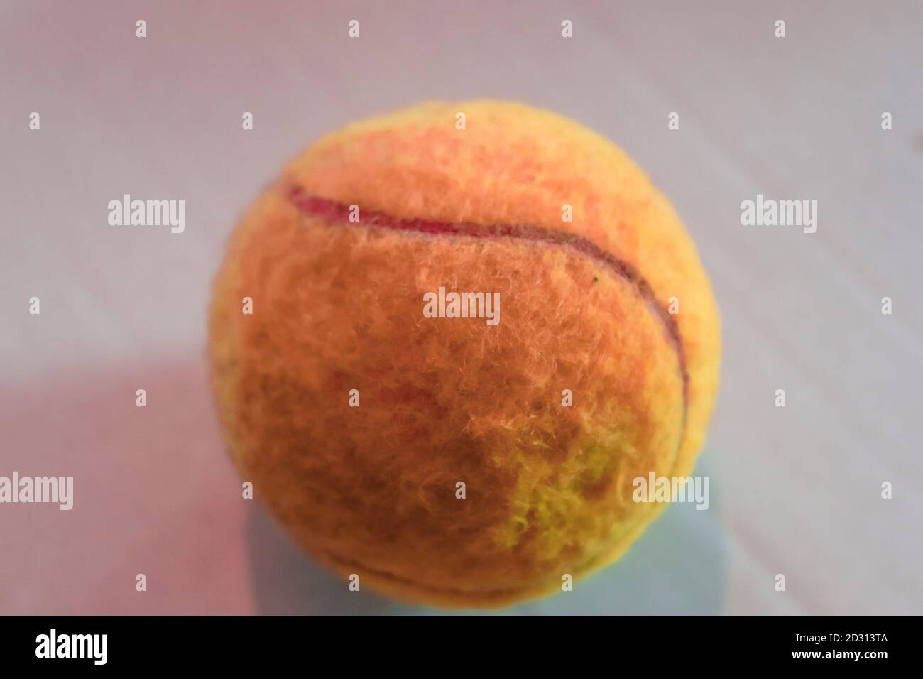 Colorful tennis ball in front of a white background Stock Photo - Alamy