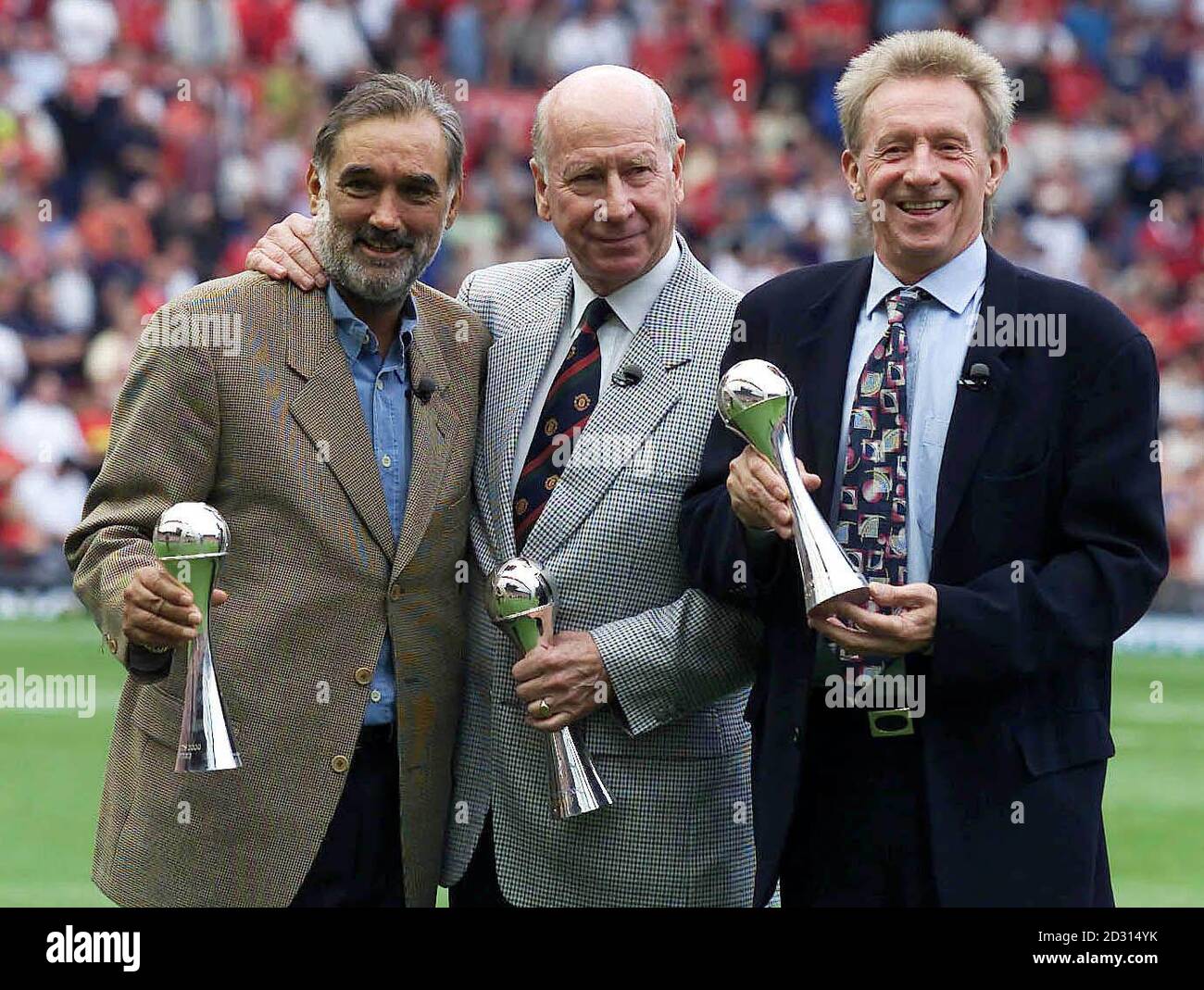 Manchester United greats Sir Bobby Charlton, centre, Denis Law and ...