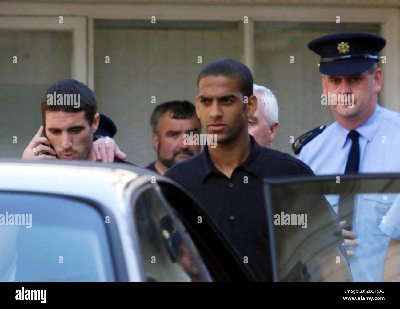 Irish international footballers Mark Kennedy (L) and Phil Babb leaving ...