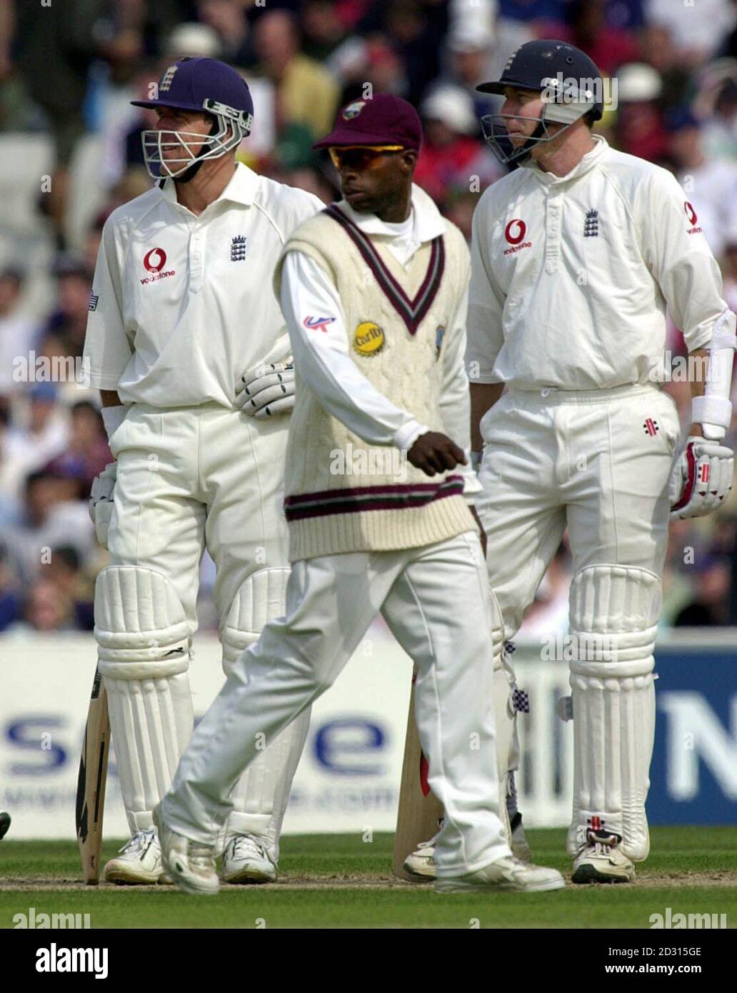 West Indies Sherwin Campbell passes England batsmen Alec Stewart (left ...