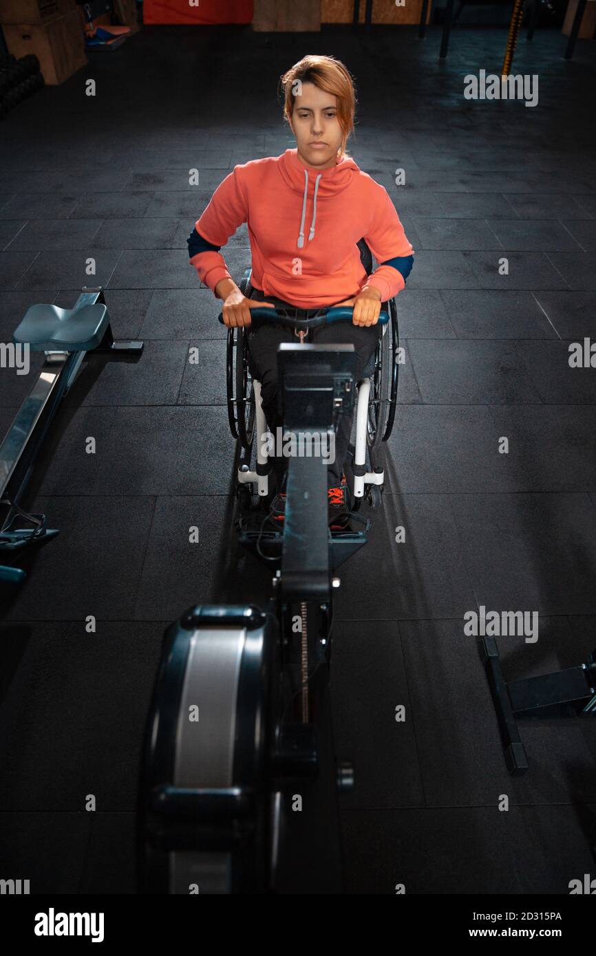 Weights. Disabled woman training in the gym of rehabilitation center ...
