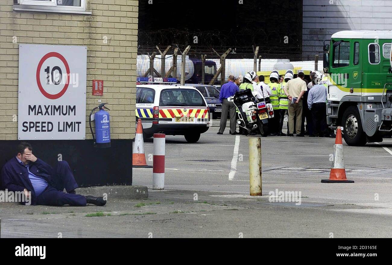 A tired tanker driver at Shell's Stanlow Oil refinery in Cheshire takes ...