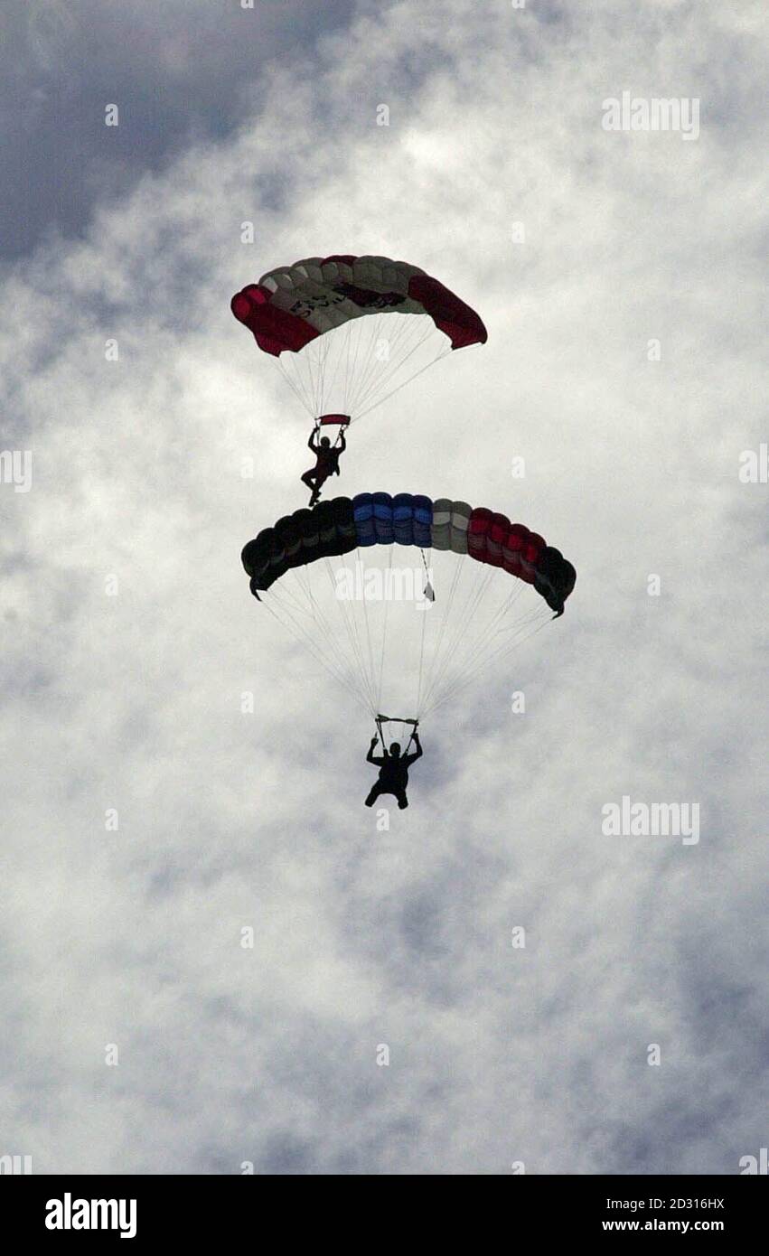 Double amputee Alastair Hodgson (bottom) completes a freefall jump with ...