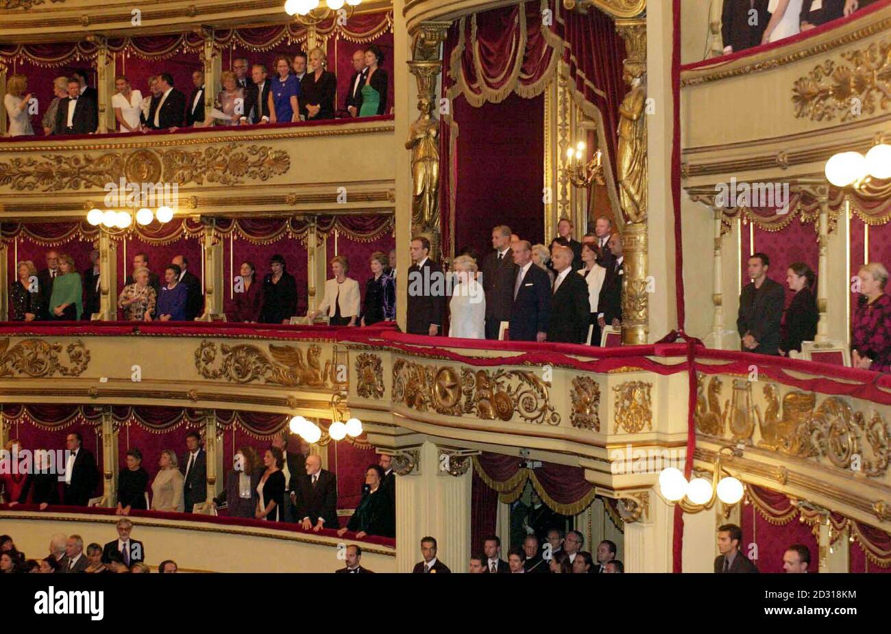 Queen Elizabeth II, in a pale blue dress, and Prince Philip, to her ...