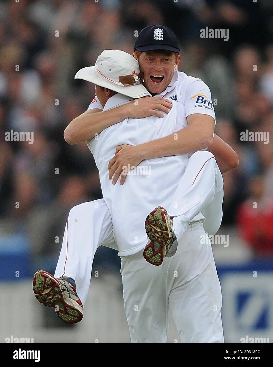 England's Jonny Bairstow is lifted off his feet by Stuart Broard after ...