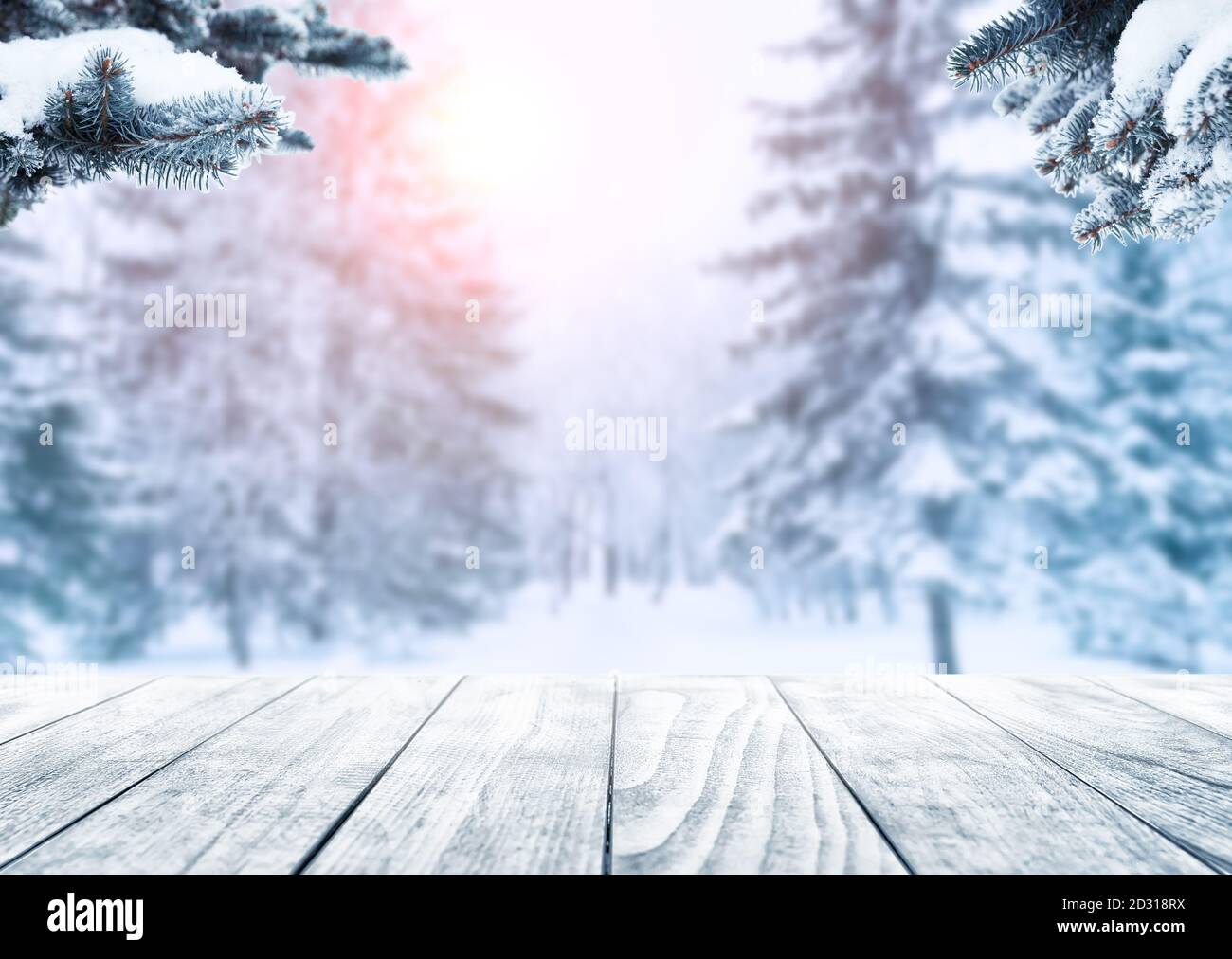 Wooden table top on winter sunny landscape with fir trees. Merry ...