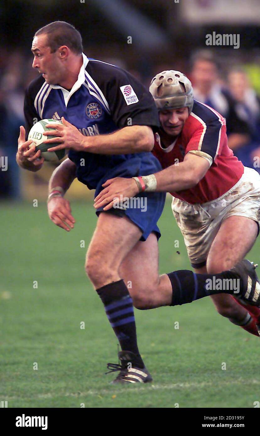 Angus Gardiner of Bath (blue and black) and Mike Mullins of Munster at ...