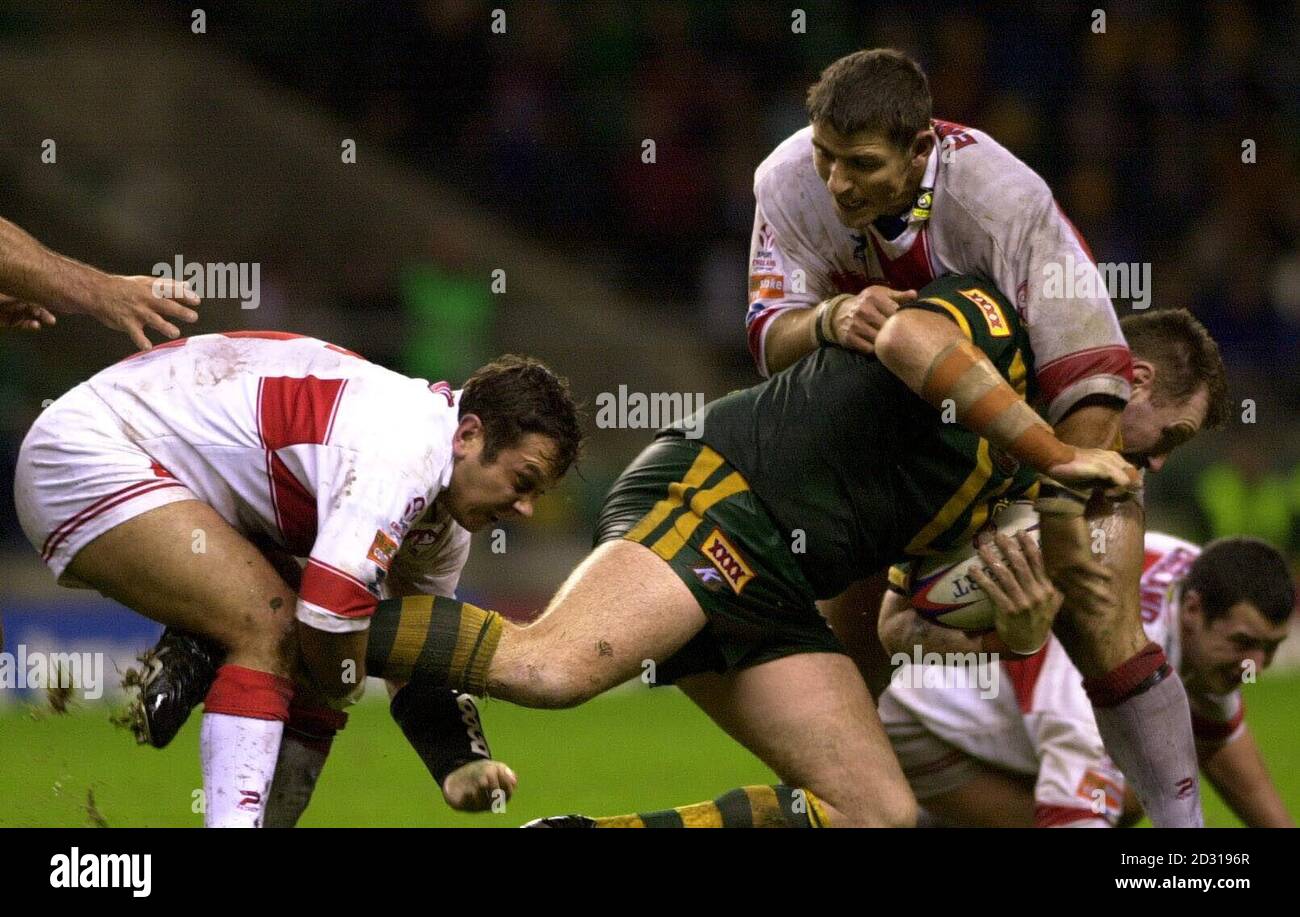 Tony Smith, (left), and Harvey Howard, top right, of England try to ...