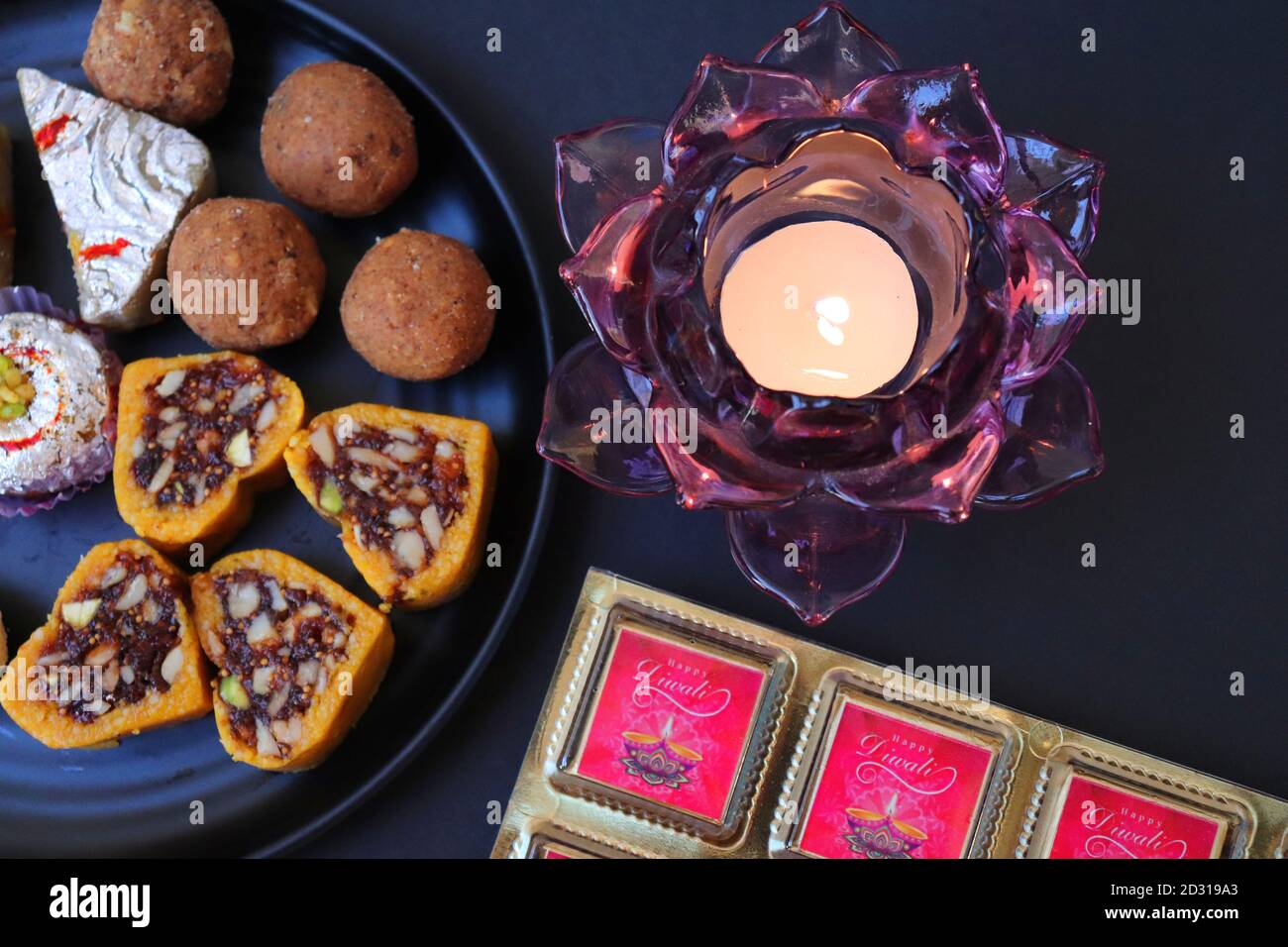 Assorted Indian sweets or Mithai, Rava laddoo, Besan laddu, dry fruits ...