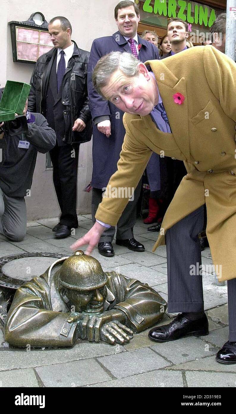 Bending down prince charles hi-res stock photography and images - Alamy