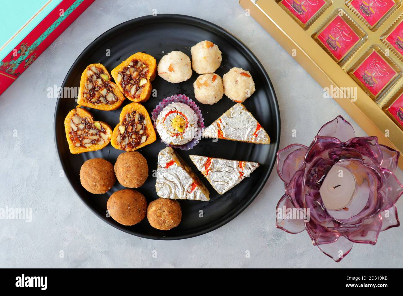 Assorted Indian sweets or Mithai, Rava laddoo, Besan laddu, dry fruits ...