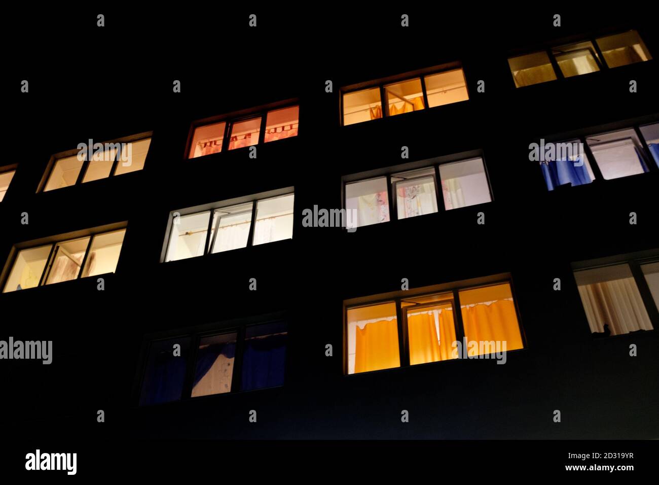 glowing windows in a residential multi-storey building at night Stock ...