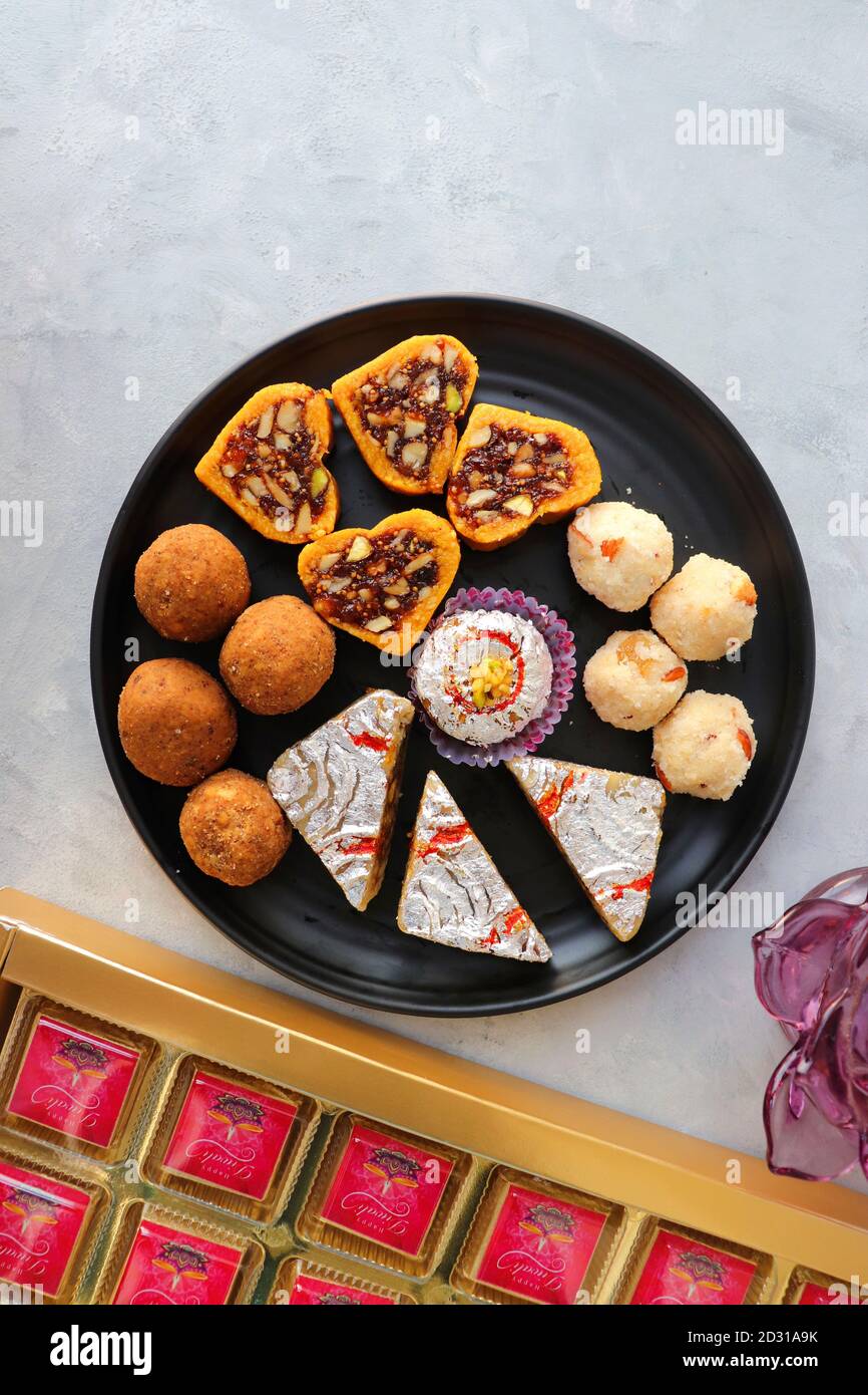 Assorted Indian sweets or Mithai, Rava laddoo, Besan laddu, dry fruits ...