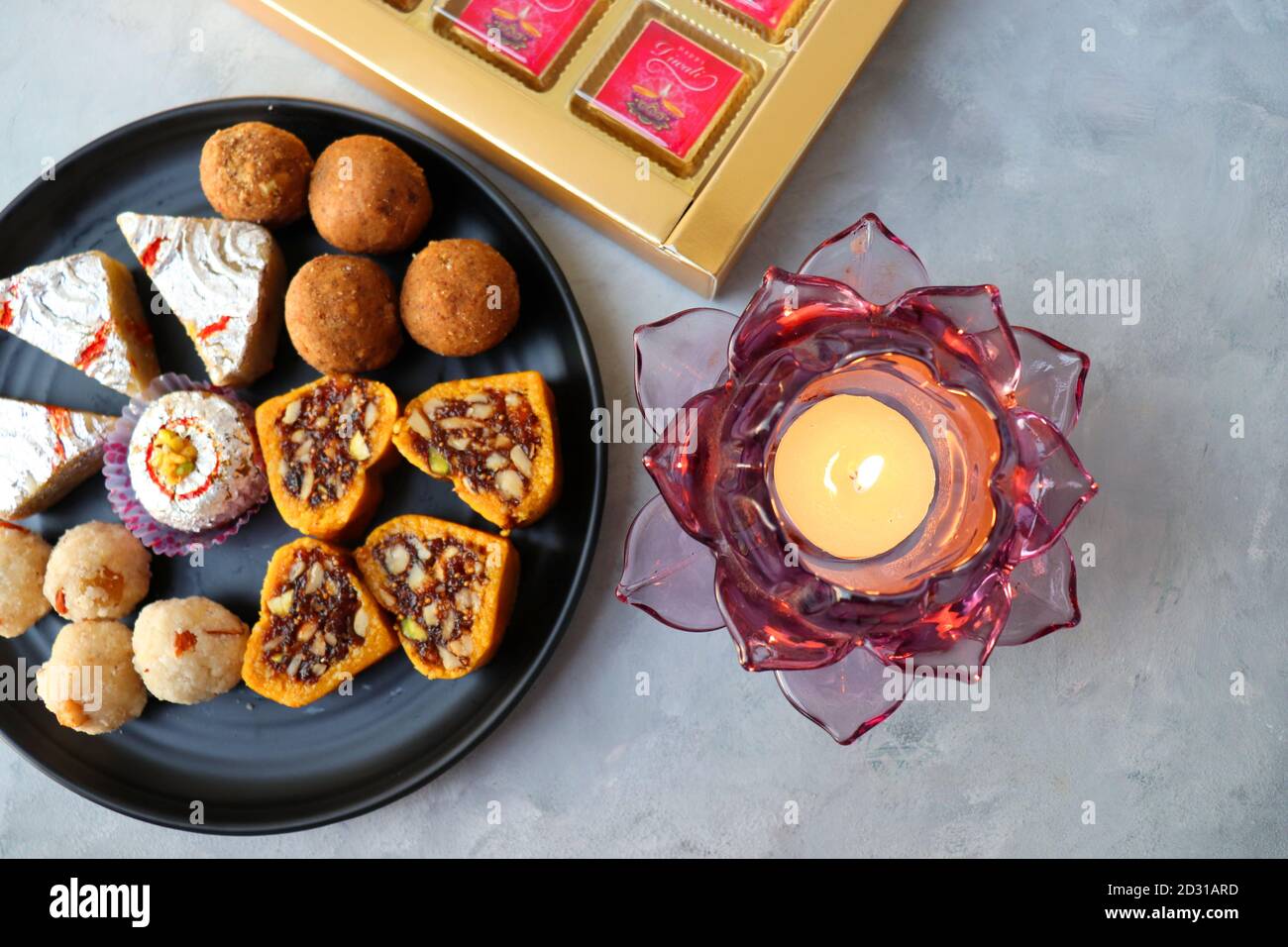 Assorted Indian sweets or Mithai, Rava laddoo, Besan laddu, dry fruits ...