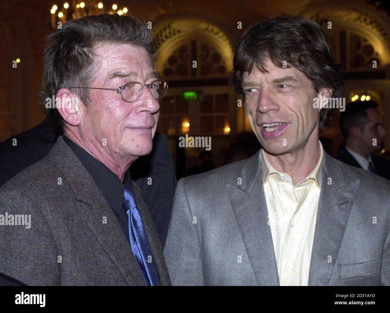 Singer Mick Jagger (R) talks to actor John Hurt at the Evening Standard ...